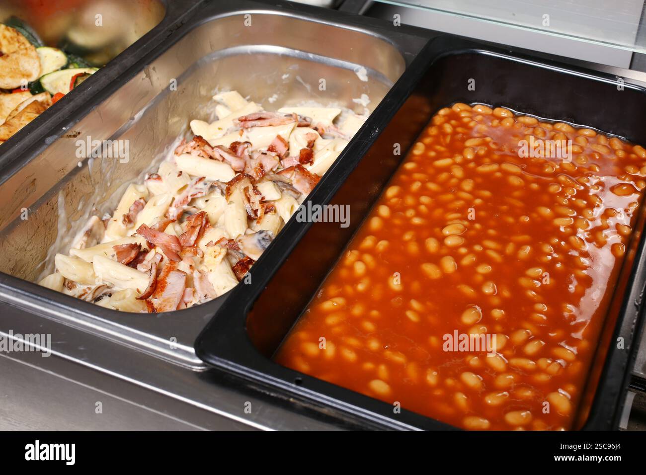 Buffet-style Baked Beans and Creamy Penne Stock Photo - Alamy