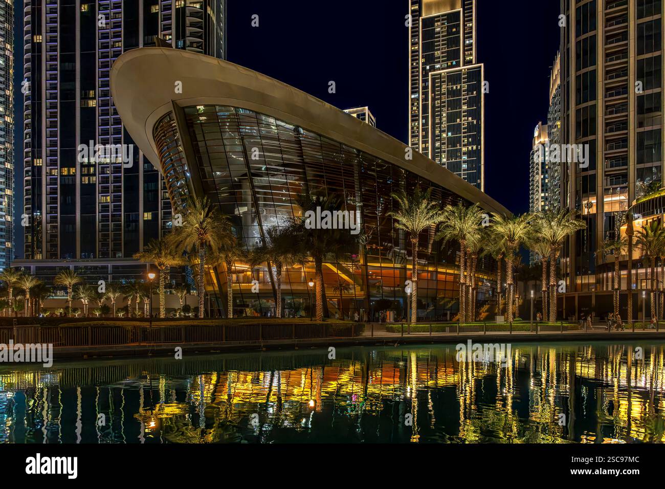 Dubai Opera House on Burj Khalifa Lake. Surrounded by twinkling ...