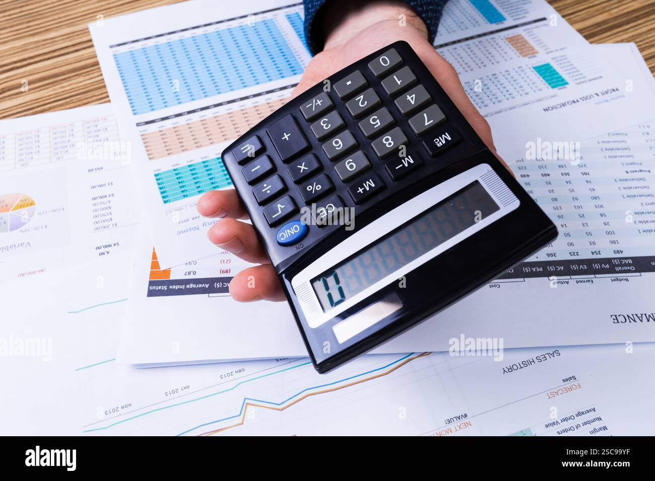 Graphs and Calculator Stock Photo - Alamy