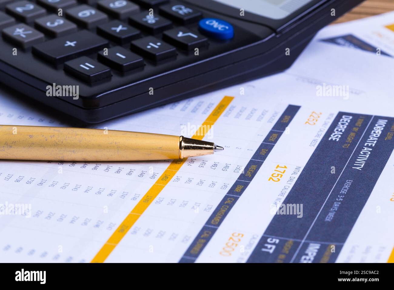 Graphs and Calculator Stock Photo - Alamy