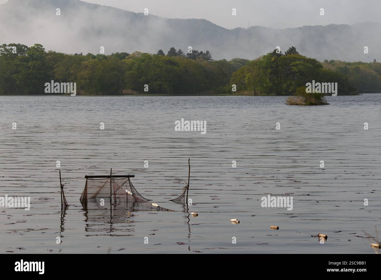 Traditional fishing net in freshwater lake, Hokkaido, Japan Stock Photo ...
