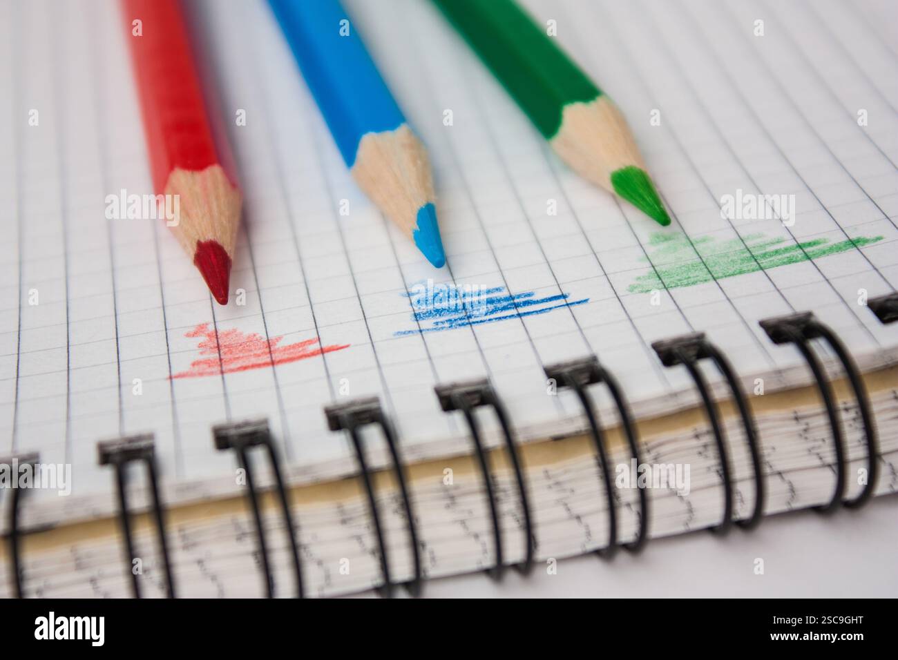 Pencils and notepad isolated on white background Stock Photo - Alamy
