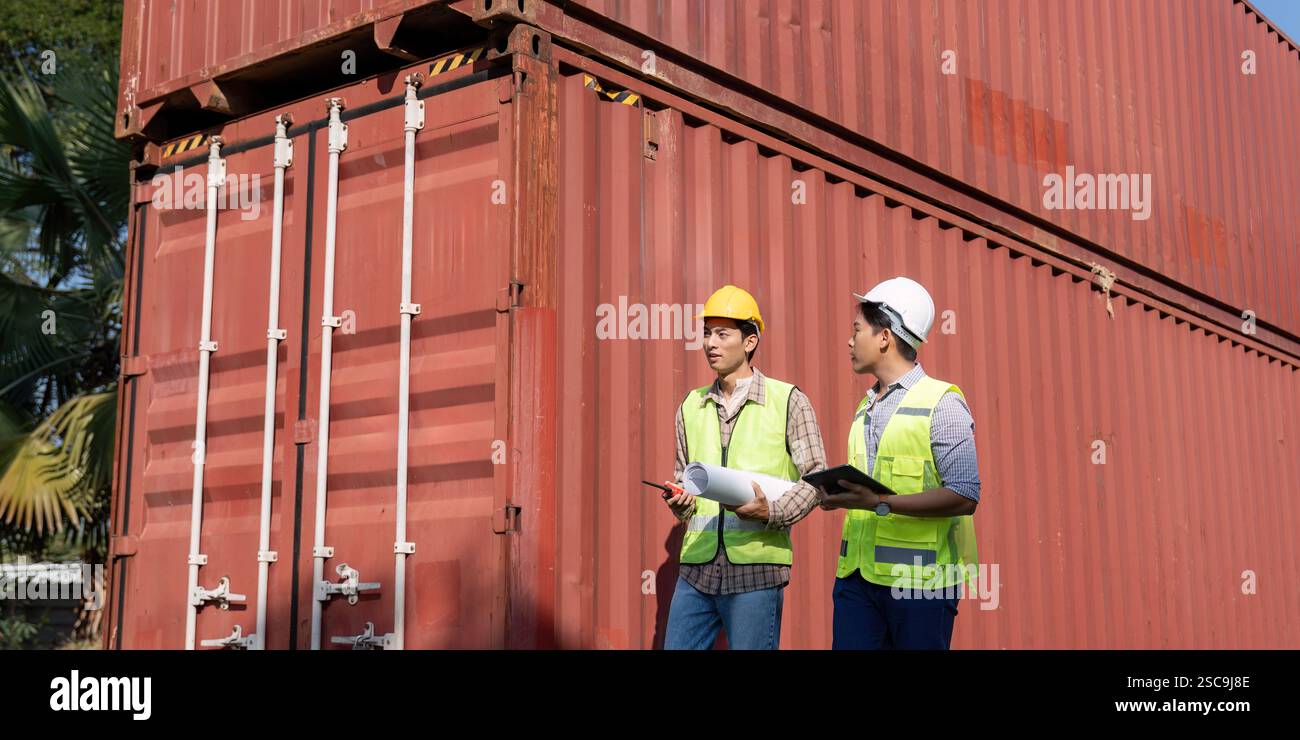 Logistics engineer overseeing container management industrial site ...
