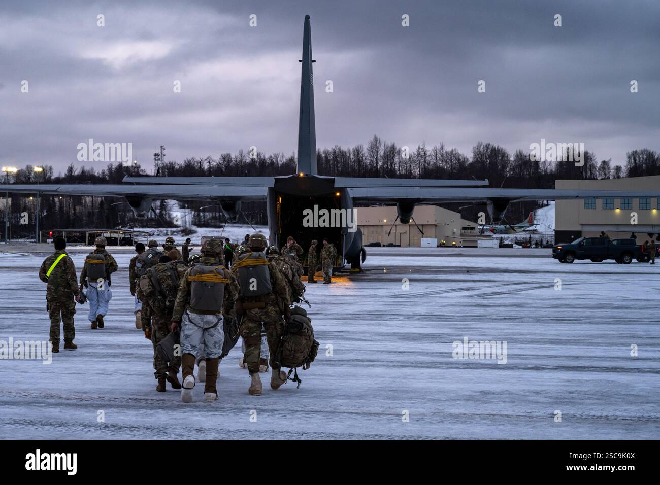 U.S. Soldiers from the 11th Airborne Division step to a C-130J Super ...
