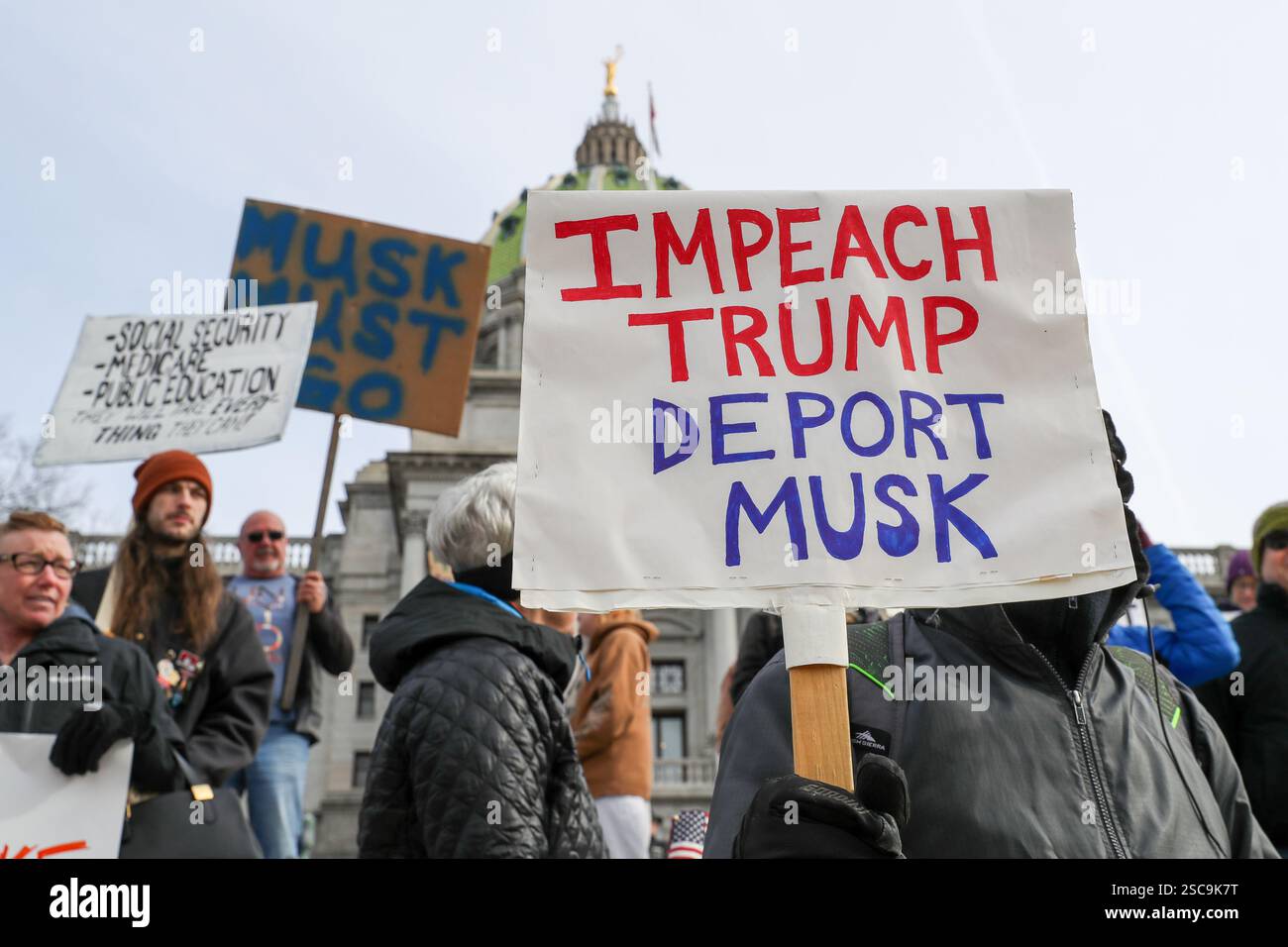 Harrisburg, United States. 05th Feb, 2025. Protesters hold placards ...