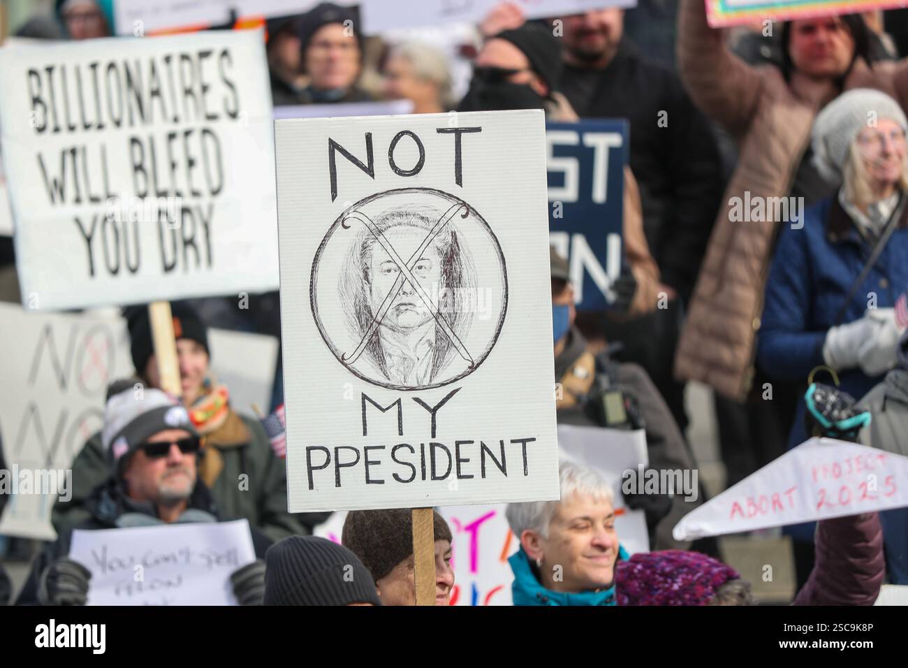 Harrisburg, United States. 05th Feb, 2025. Protesters hold placards ...