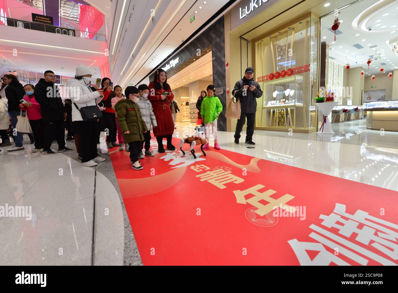 People visit an AI-themed technology temple fair in Beijing, China, 30 ...