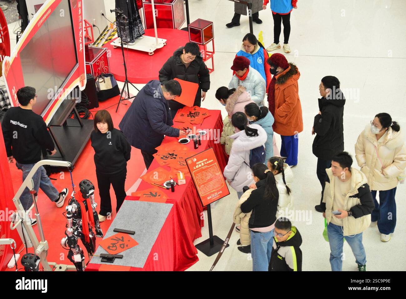 People visit an AI-themed technology temple fair in Beijing, China, 30 ...