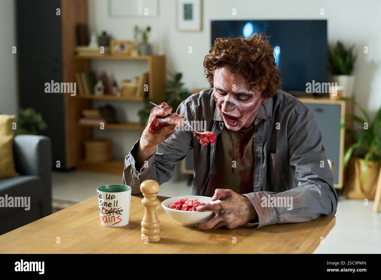 Zombie eating hi-res stock photography and images - Alamy