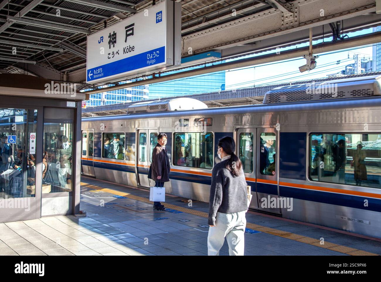 Kobe Station platform with people waiting for the train to Osaka Stock ...
