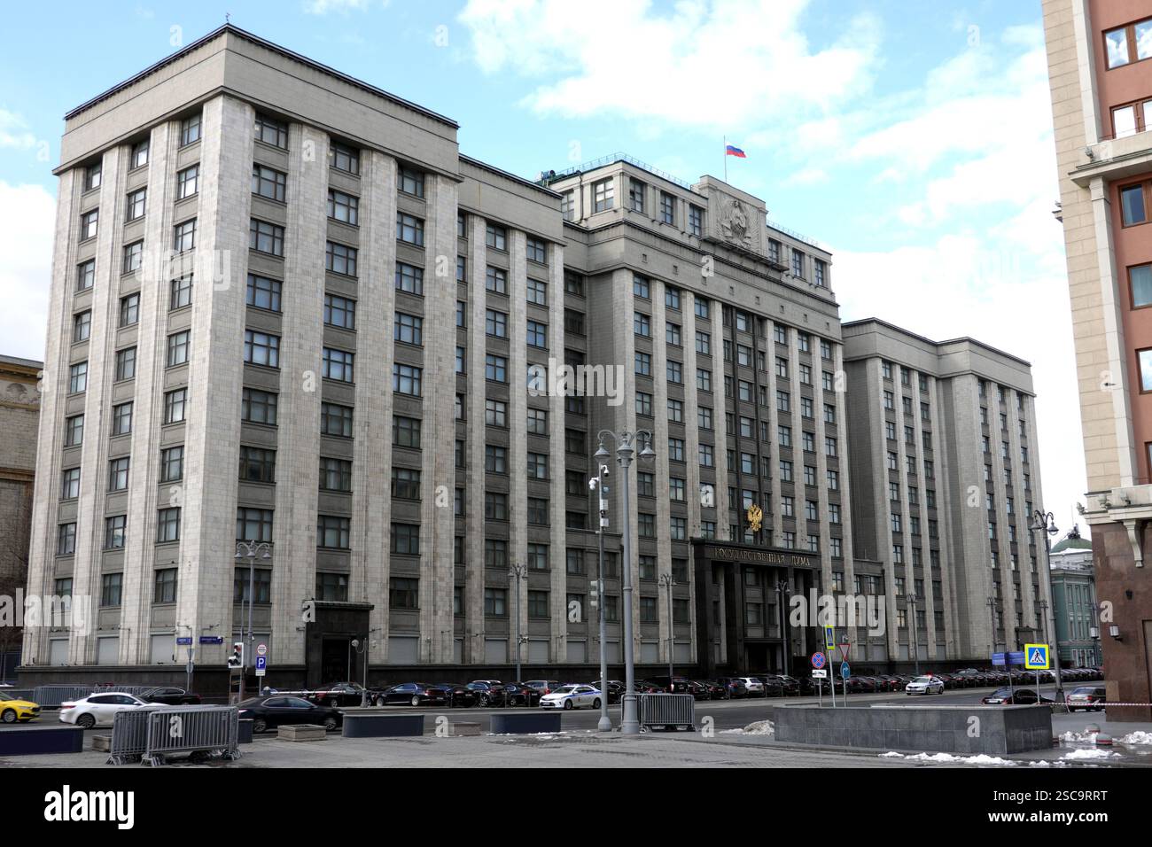 The State Duma of Russian Federation building with many official cars ...