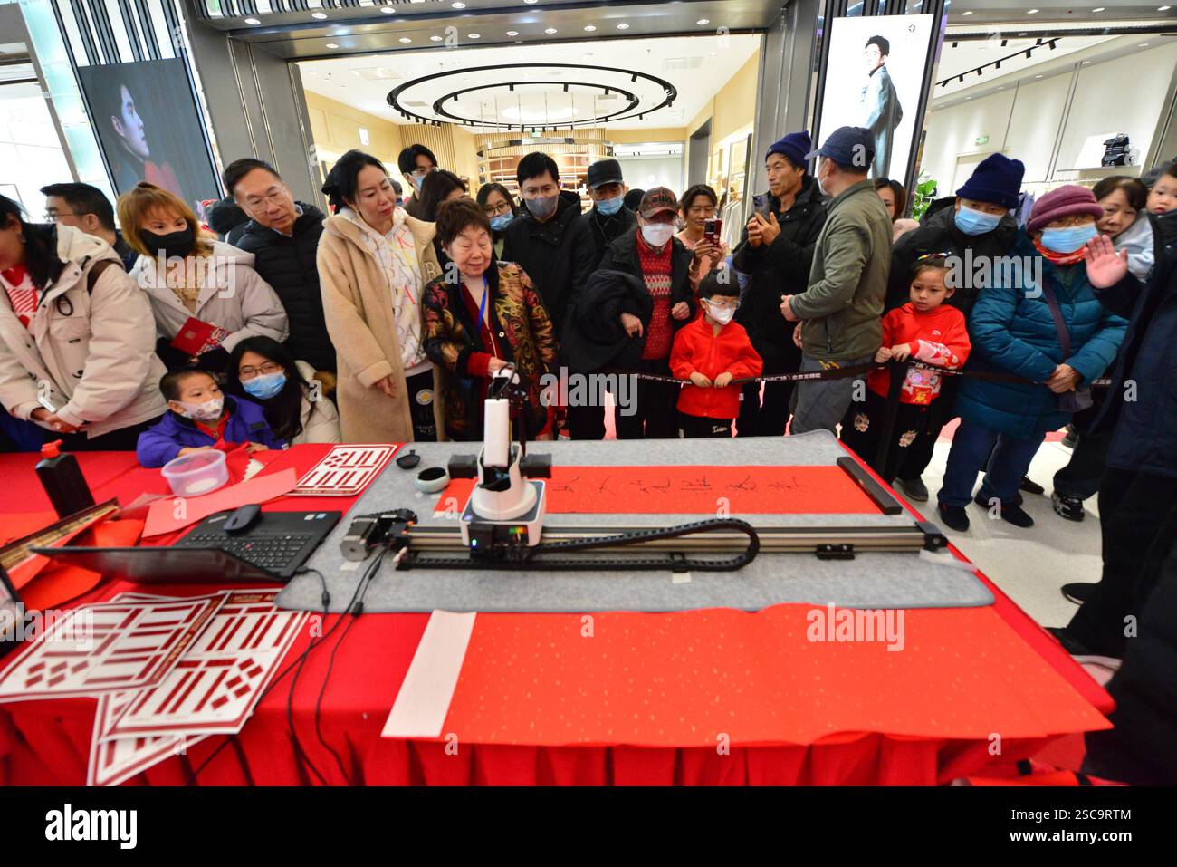 People visit an AI-themed technology temple fair in Beijing, China, 30 ...