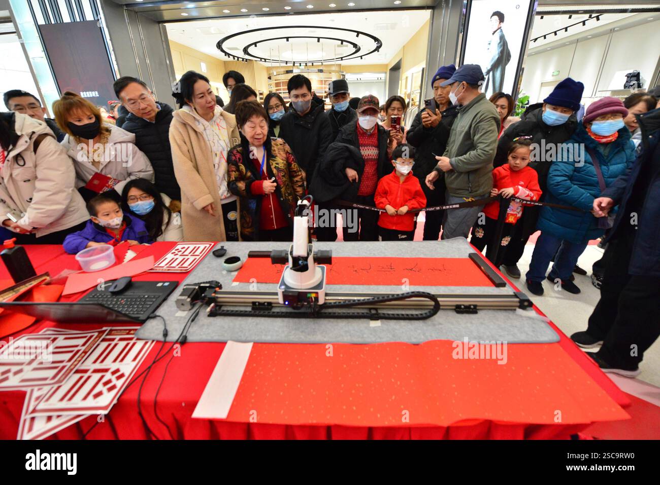 People visit an AI-themed technology temple fair in Beijing, China, 30 ...