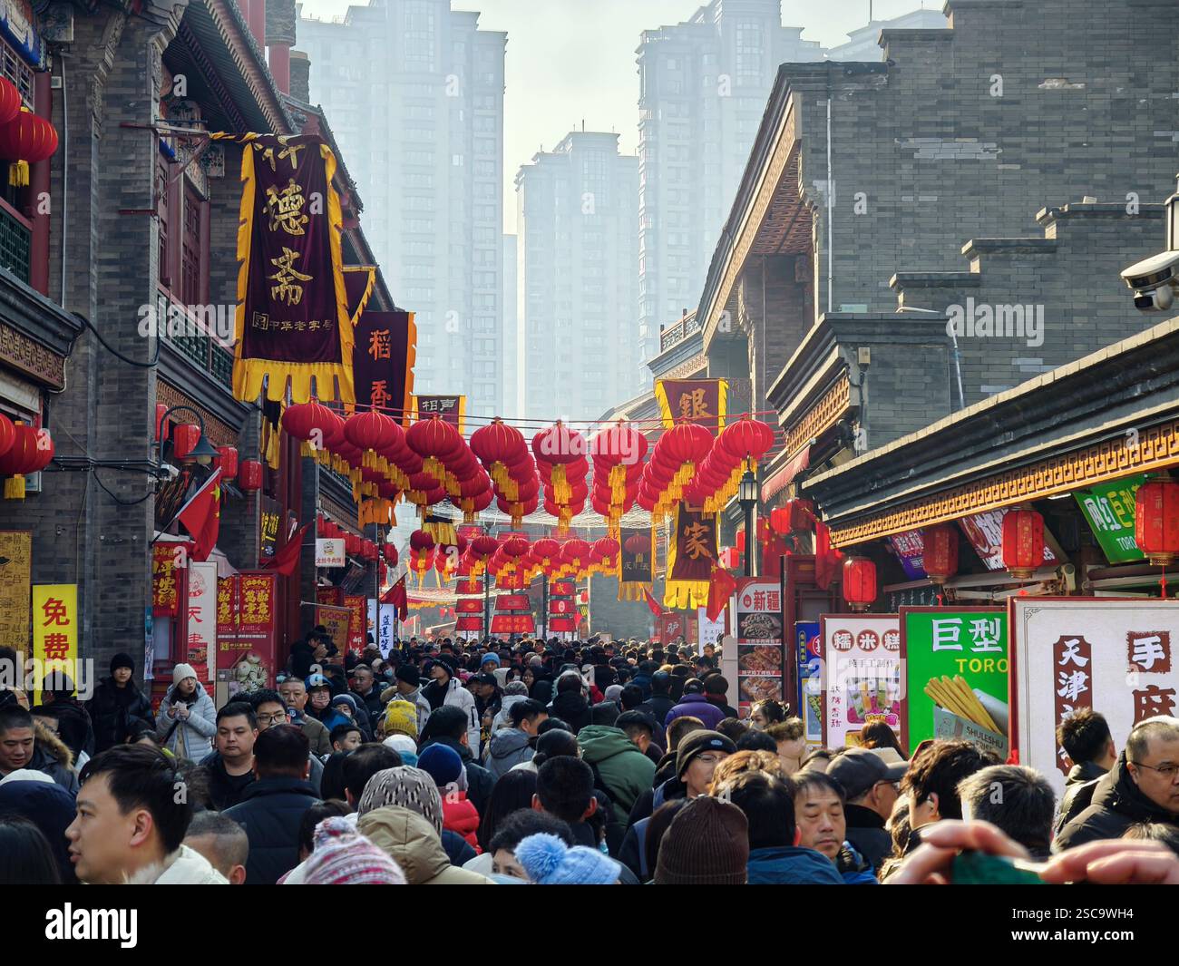 People stroll in the ancient block to celebrate the Spring Festival in ...