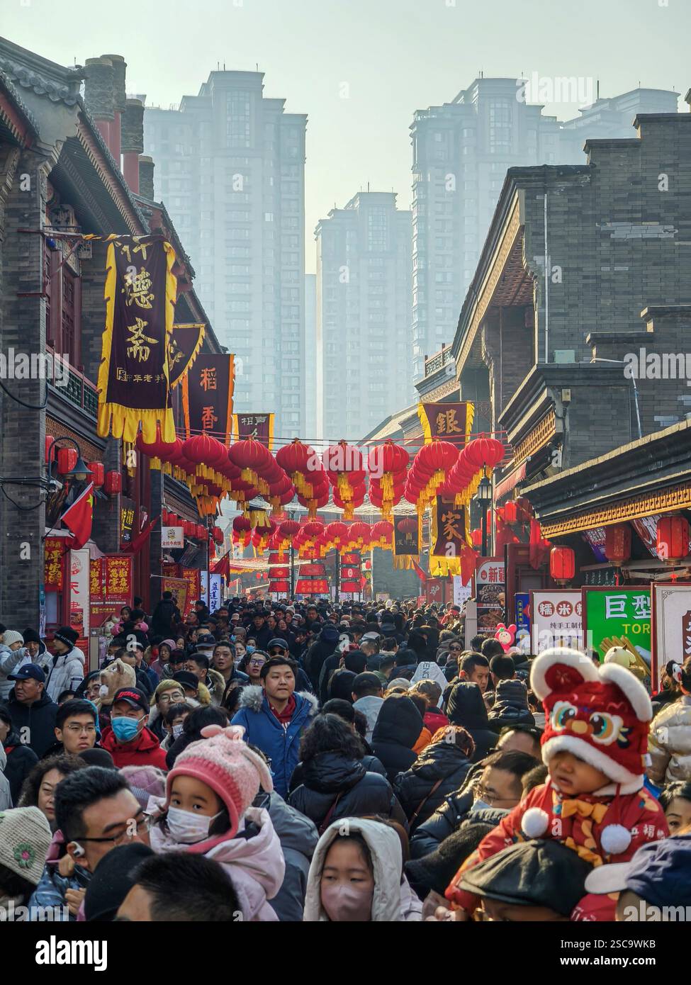 People stroll in the ancient block to celebrate the Spring Festival in ...