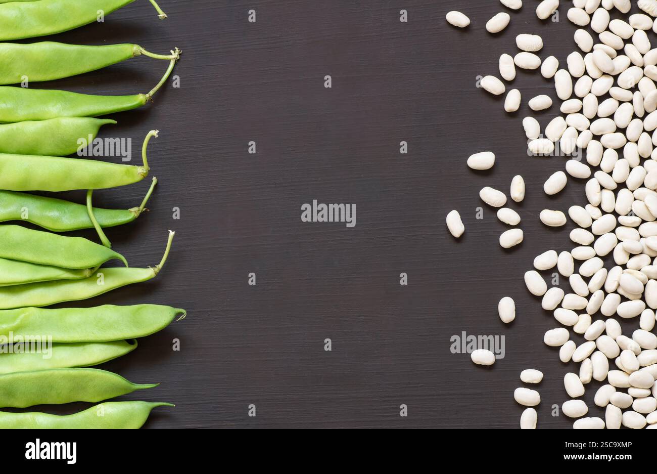 Uncooked dried white haricot beans with fresh raw green beans pod plant ...