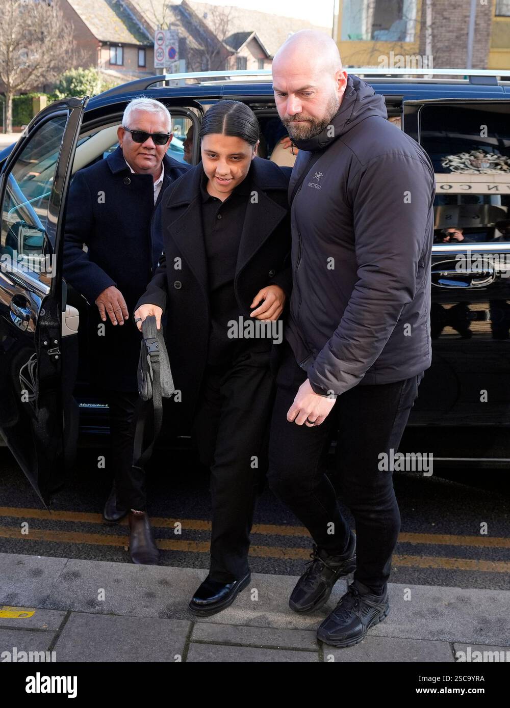 Chelsea and Australia striker Sam Kerr (centre) arrives with her father ...