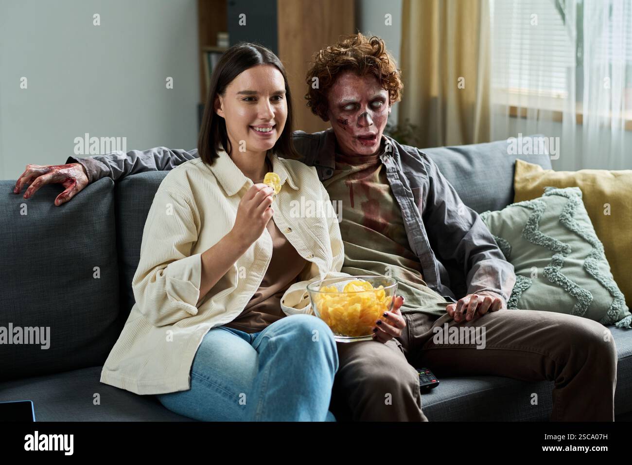 Woman And Her Zombie Boyfriend Watching Film In Living Room Stock Photo ...