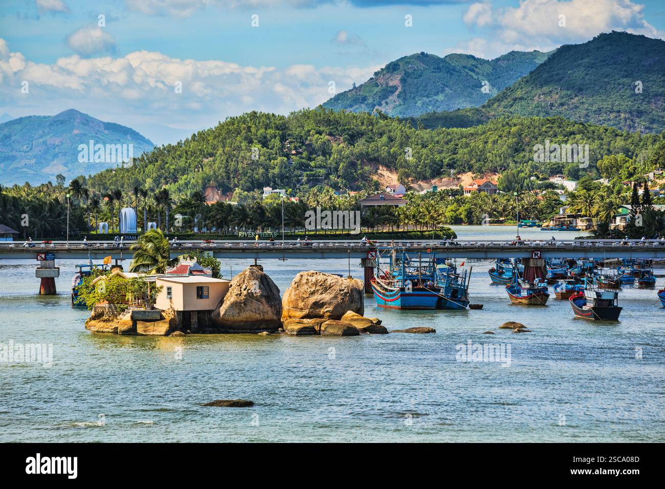 Nha Trang, Vietnam, NOV, 11, 2014. Boats and rocks near fishing village ...