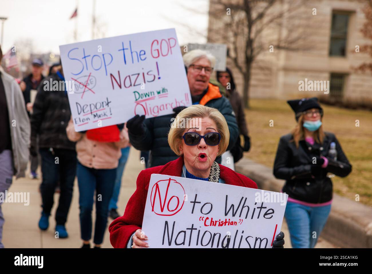 A demonstrator holds a sign that reads, “No to White “Christian ...