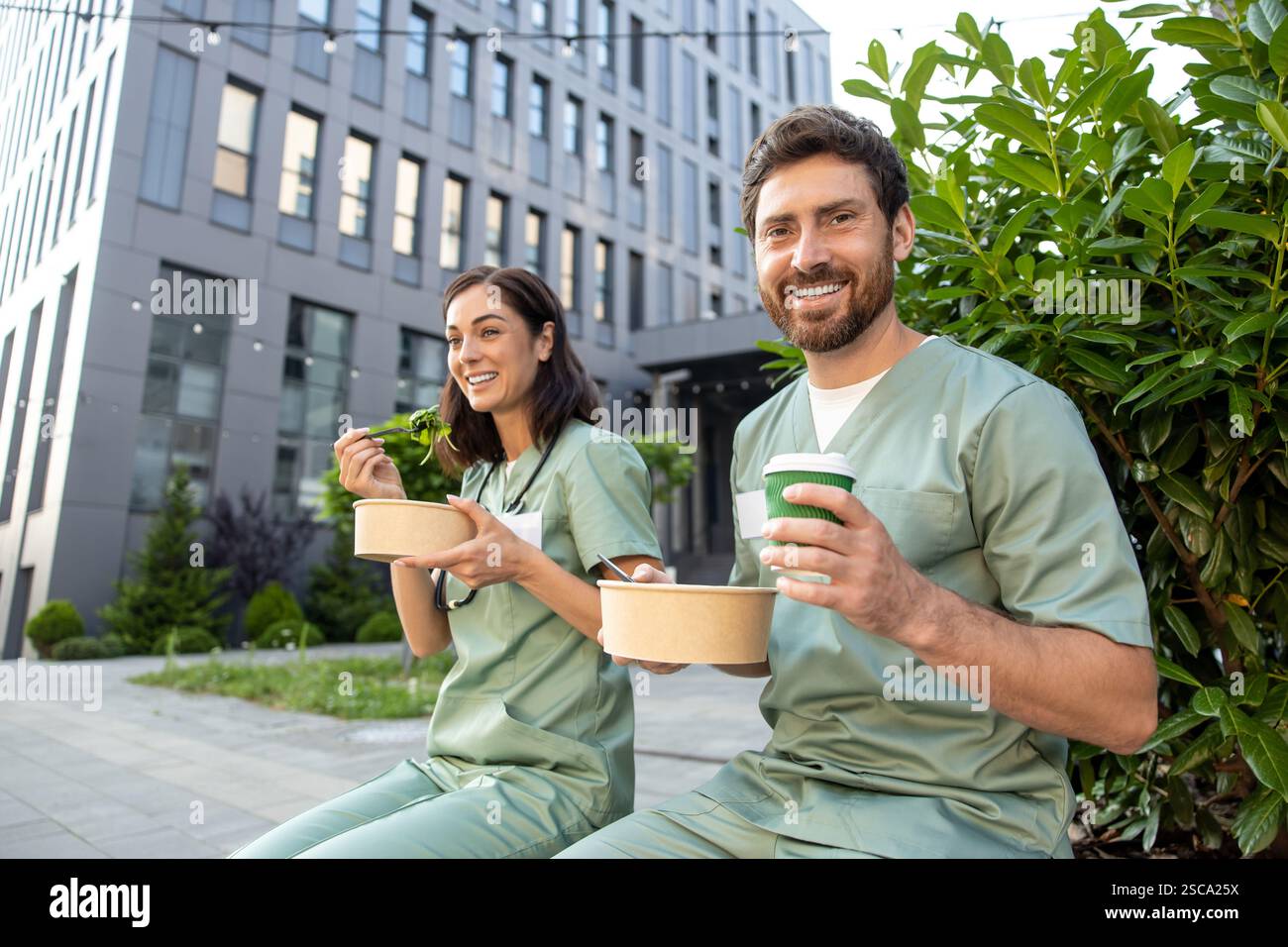 Doctors having lunch together and looking positive and smiling Stock ...