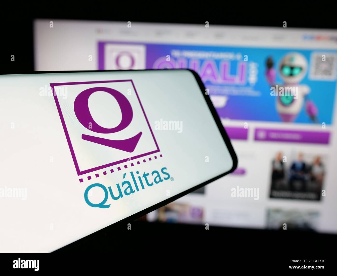 In this photo illustration, a mobile phone with the logo of Mexican company Qualitas ...