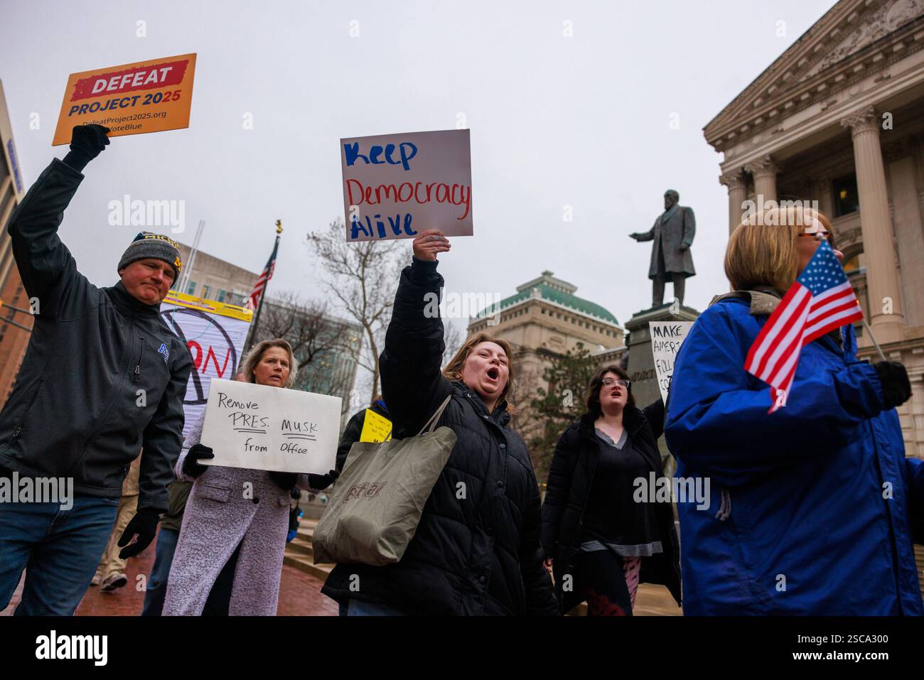 Demonstrators march with signs during an anti-Trump protest at the ...