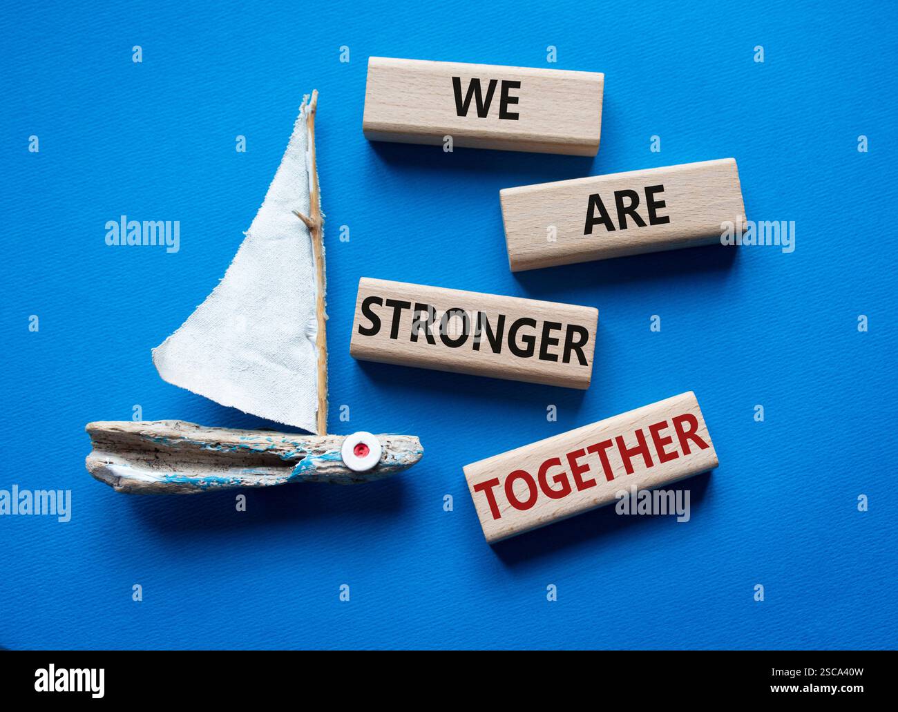 We are stronger together symbol. Wooden blocks with words We are ...