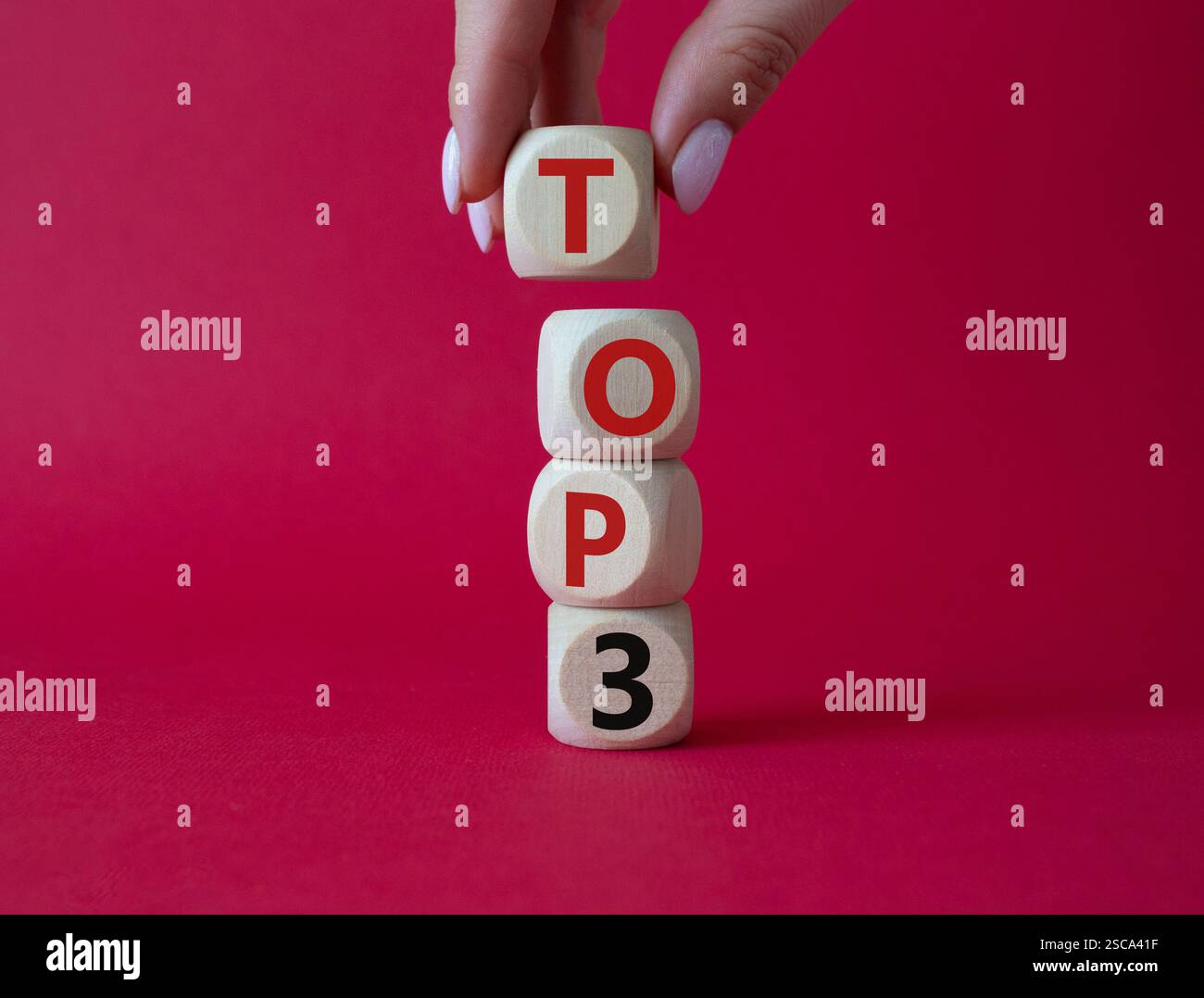 Top 3 symbol. Concept word Top 3 on wooden cubes. Businessman hand ...