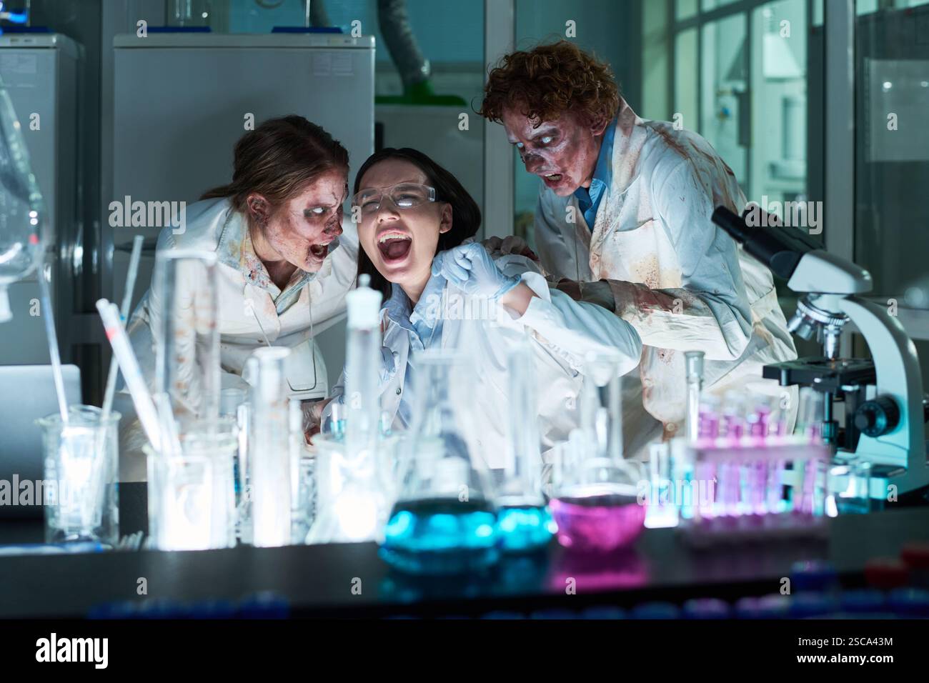 Hungry Zombies Attacking Lab Worker Stock Photo - Alamy