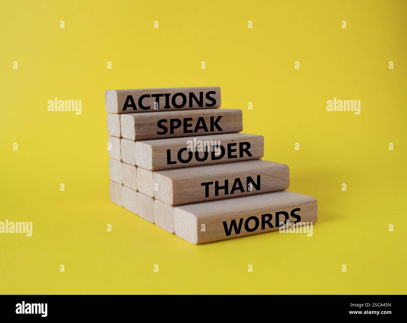 Actions speak louder than Words symbol. Wooden blocks with words ...