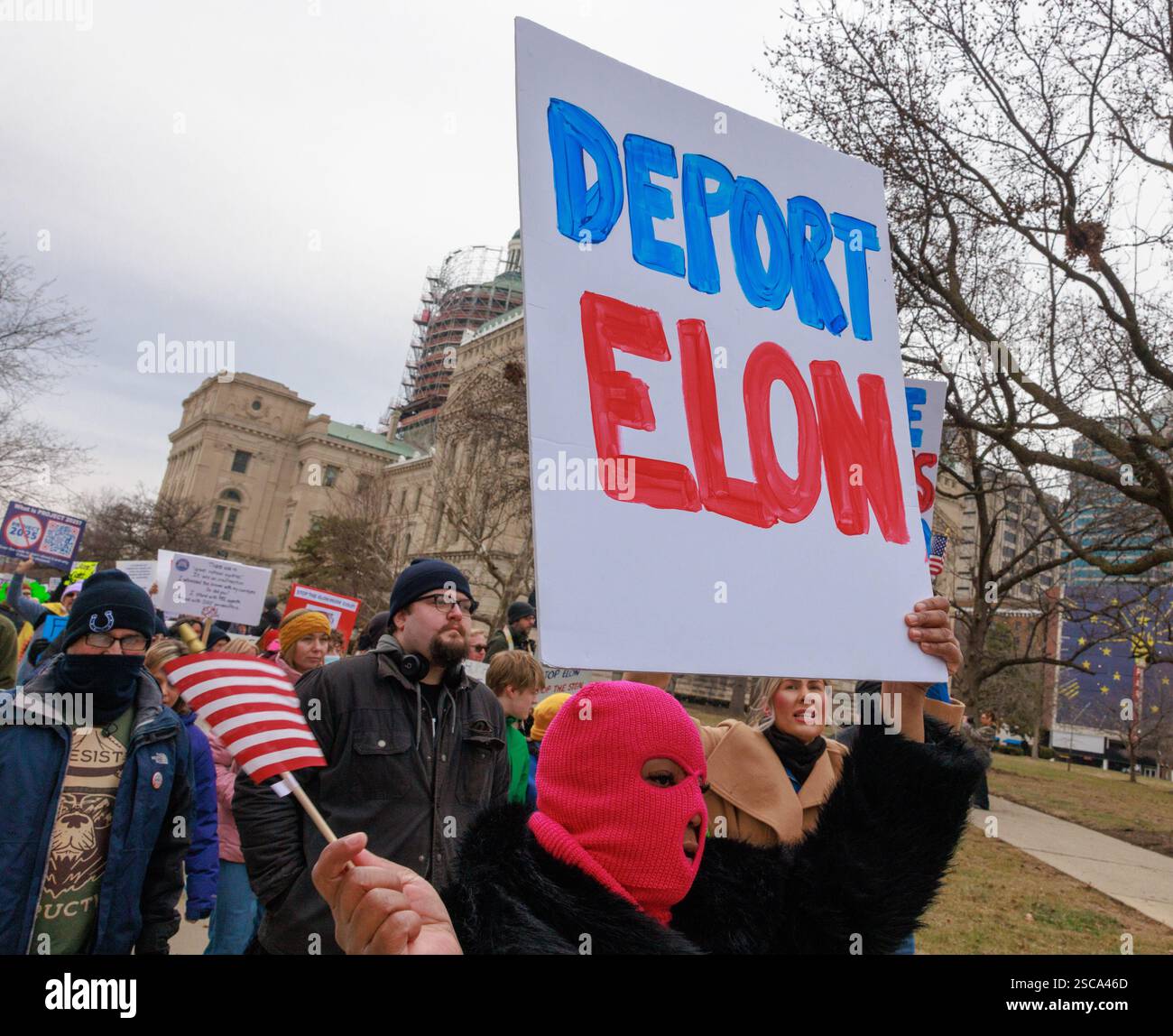 A demonstrator holds a sign that reads, “Deport Elon,” during an anti ...