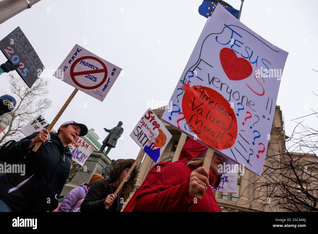 Demonstrators march with signs during an anti-Trump protest at the ...
