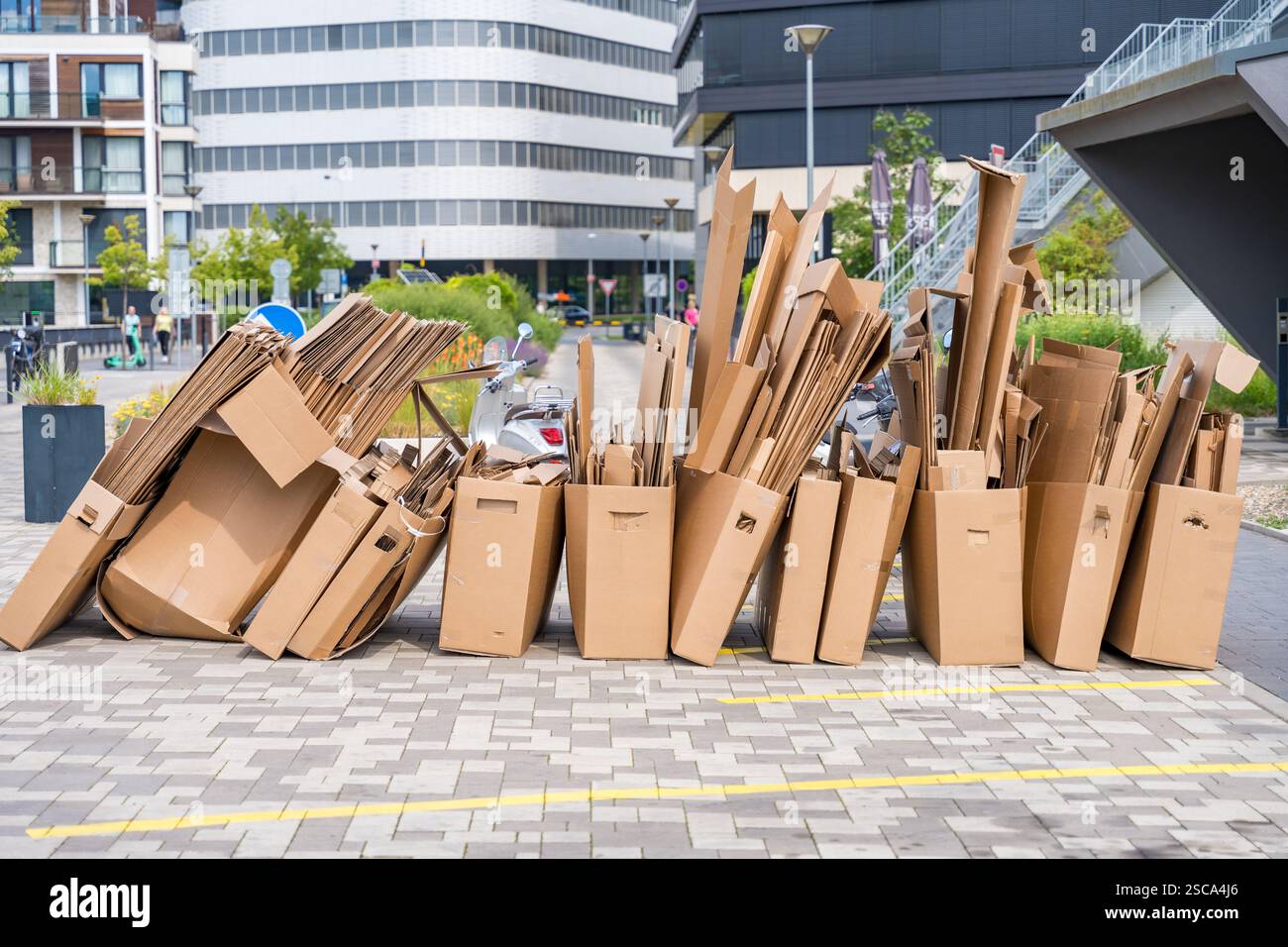 Stacked cardboard boxes prepared for recycling in an urban area in ...