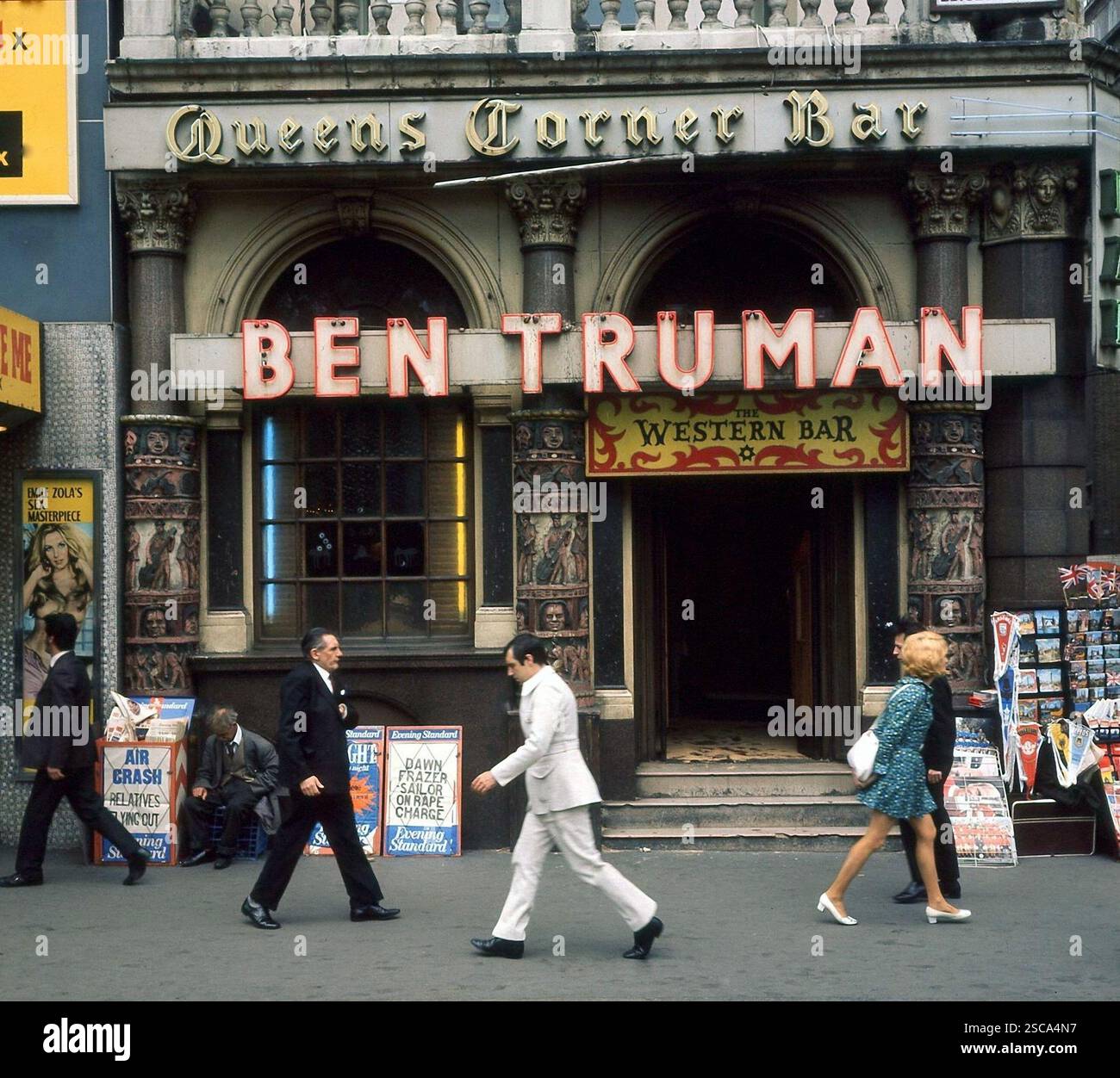 Passersby, newspapers and bar in London (Western Bar, Queens Corner Bar ...