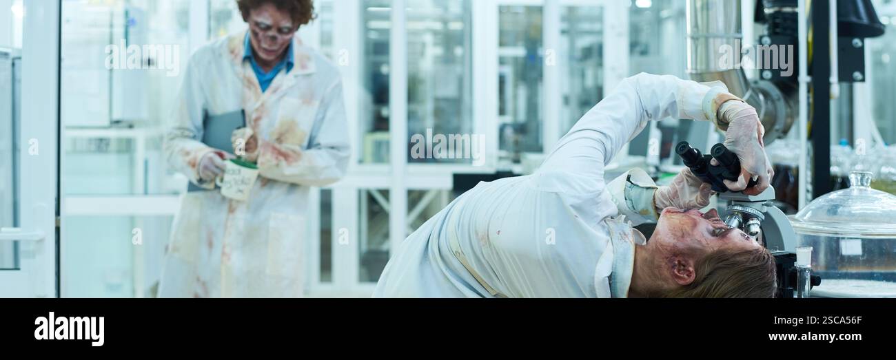 Creepy Walking Dead Pretending To Work In Lab Header Stock Photo - Alamy
