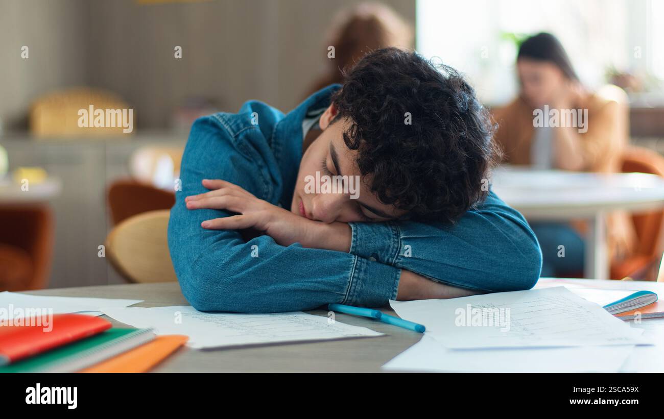 Tired sleepy napping exhausted fatigued overworked overload pupil teen ...