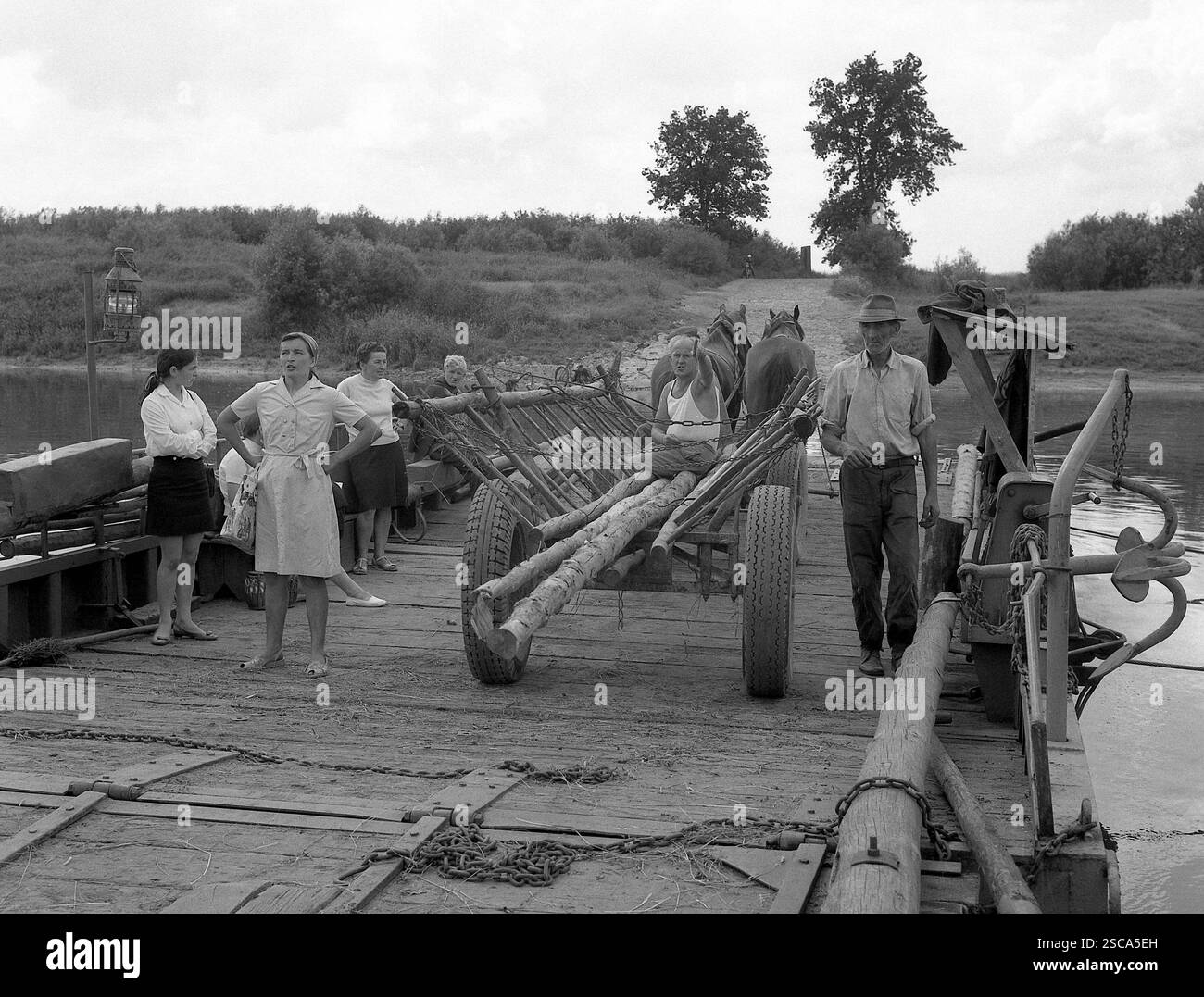 People and a horse carriage on a ferry across River Bug in Poland Stock ...
