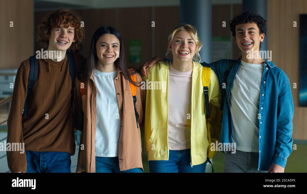 Happy smiling Caucasian four friends students teenagers students teens ...