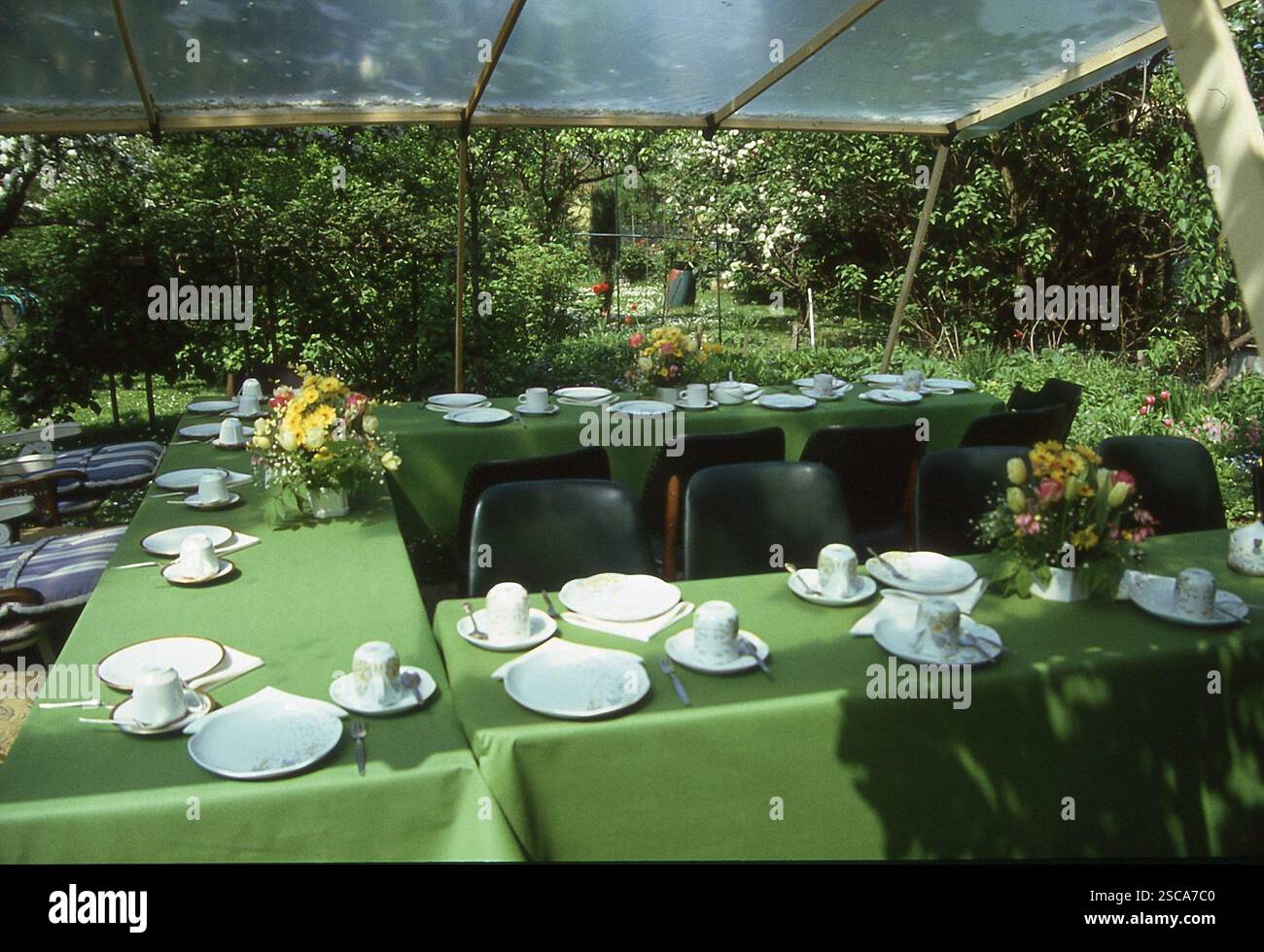 Ready laid table for a party in a garden in Berlin Stock Photo - Alamy