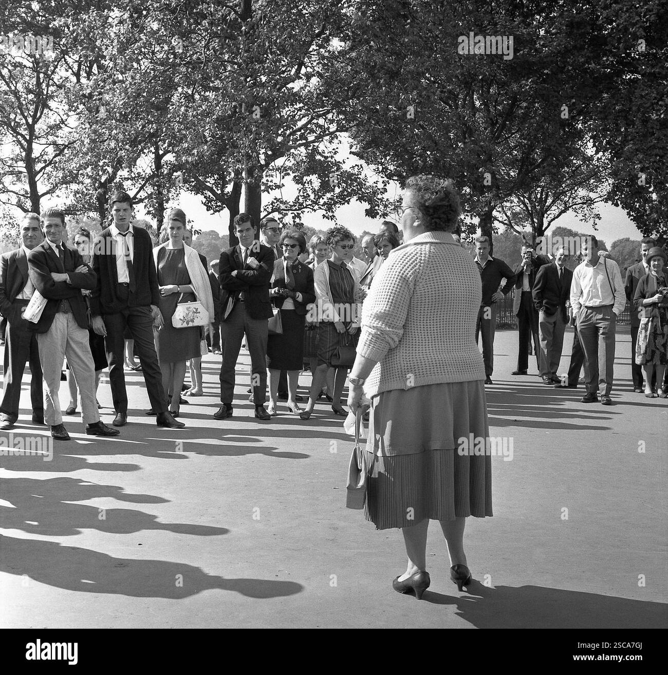 Woman and spectators at the Speakers' Corner at Hyde Park in London ...