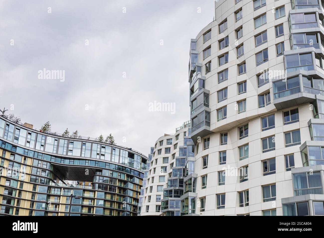 Modern Curved Buildings in an Urban Setting Under Cloudy Sky Stock ...