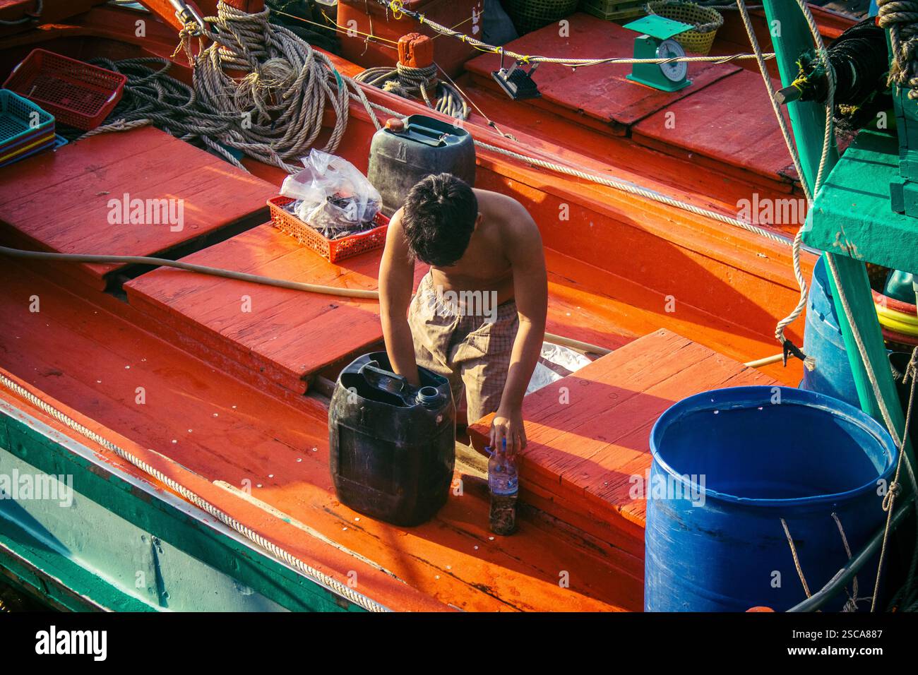 Preak Svay, Koh Rong Island, Cambodia, February 6, 2025 Fisherman in an ...