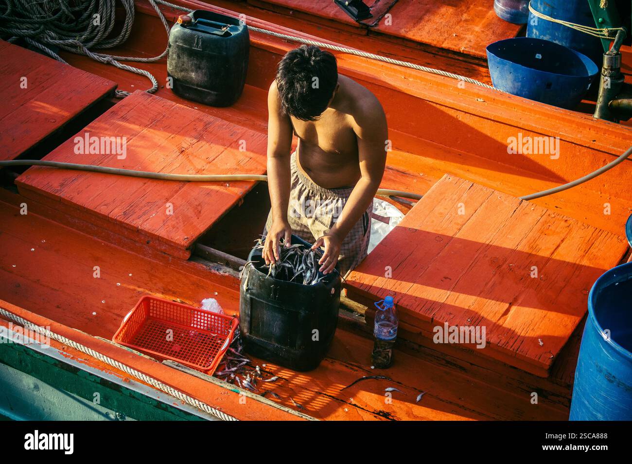 Preak Svay, Koh Rong Island, Cambodia, February 6, 2025 Fisherman in an ...