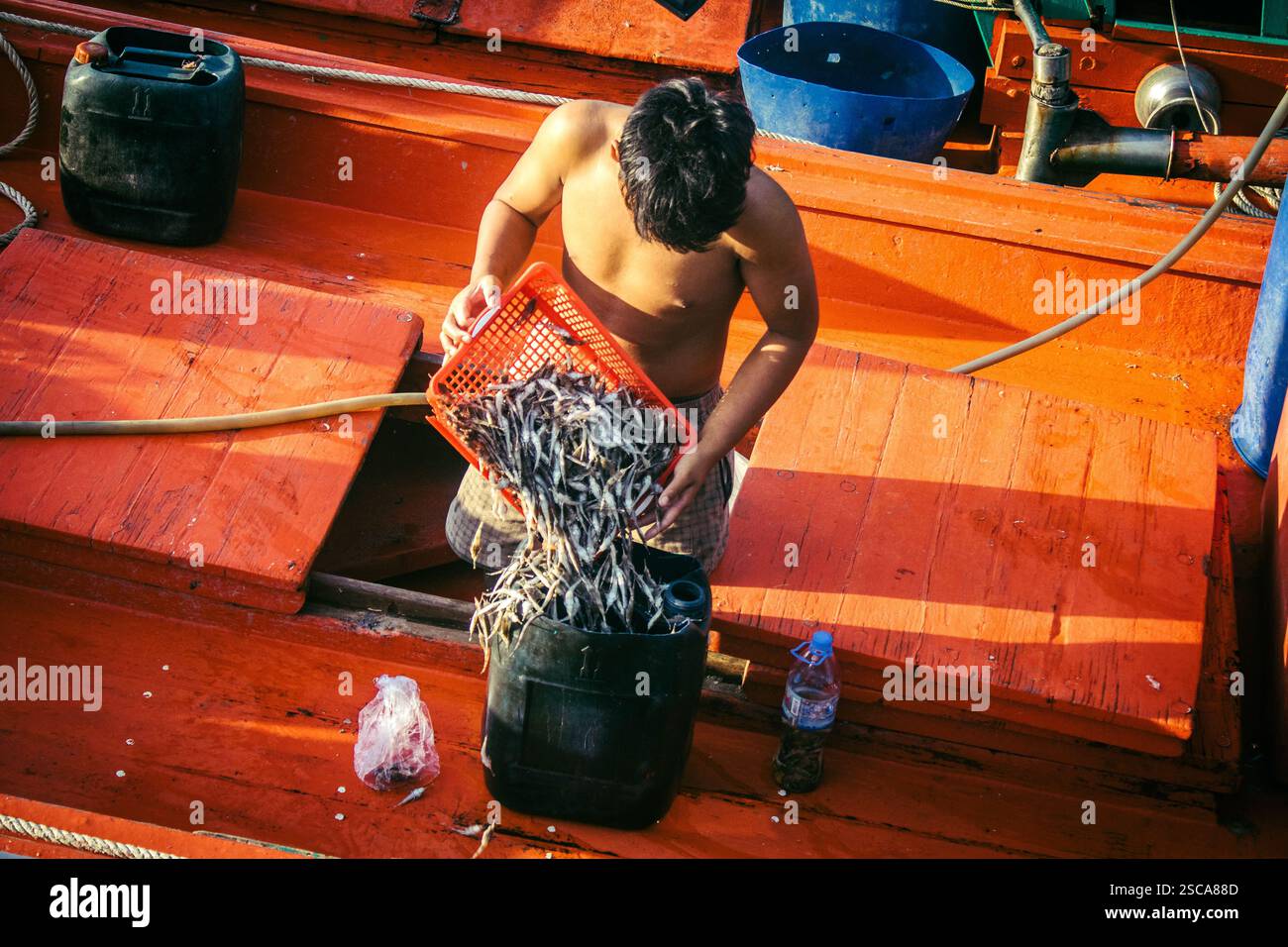 Preak Svay, Koh Rong Island, Cambodia, February 6, 2025 Fisherman in an ...