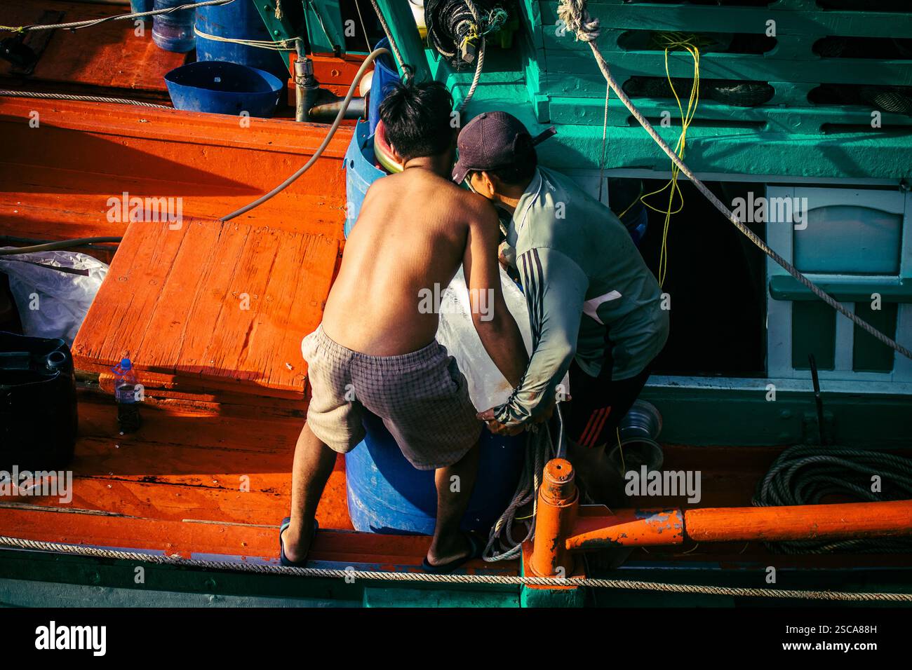 Preak Svay, Koh Rong Island, Cambodia, February 6, 2025 Fisherman in an ...