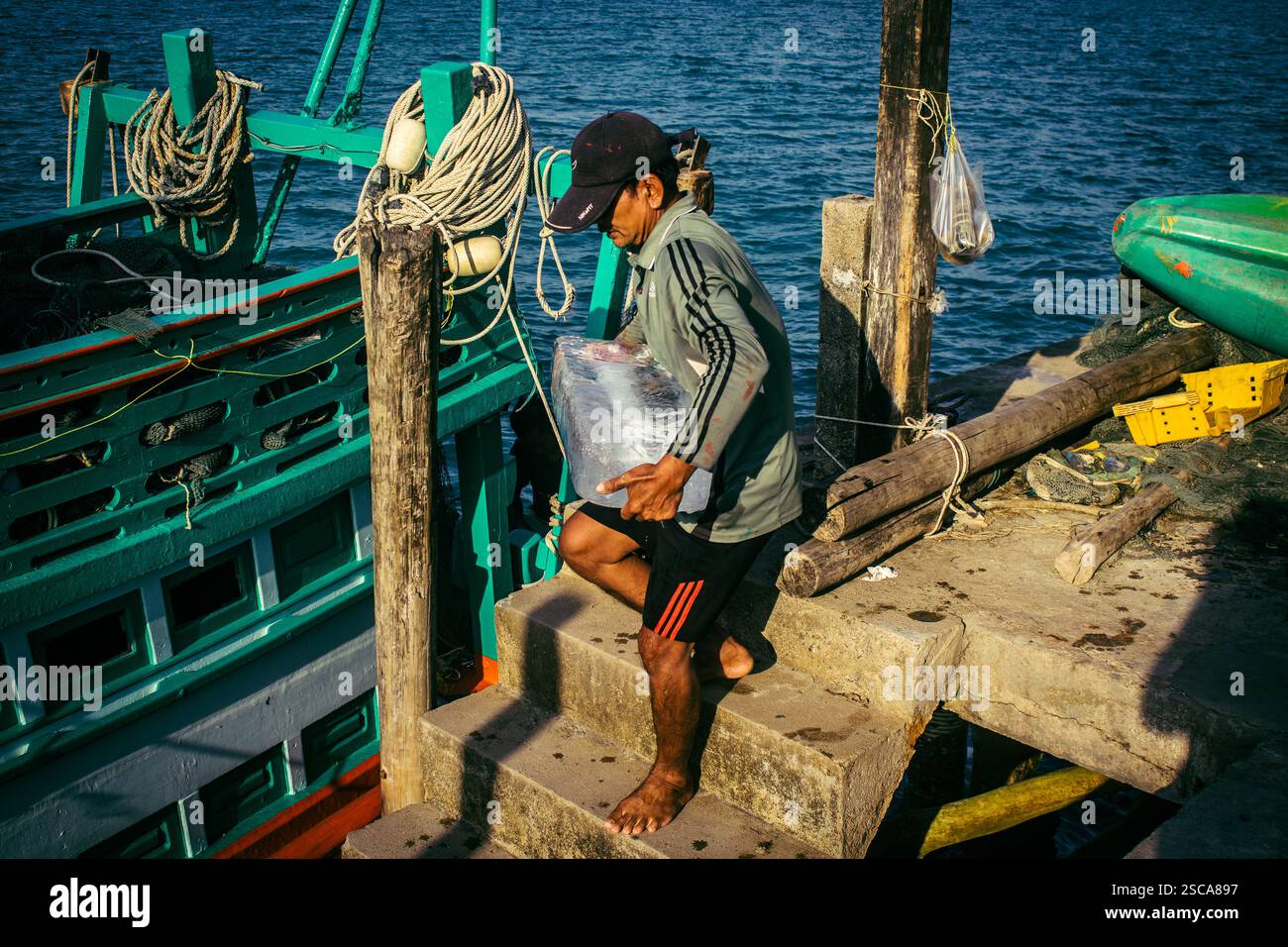 Preak Svay, Koh Rong Island, Cambodia, February 6, 2025 Fisherman in an ...