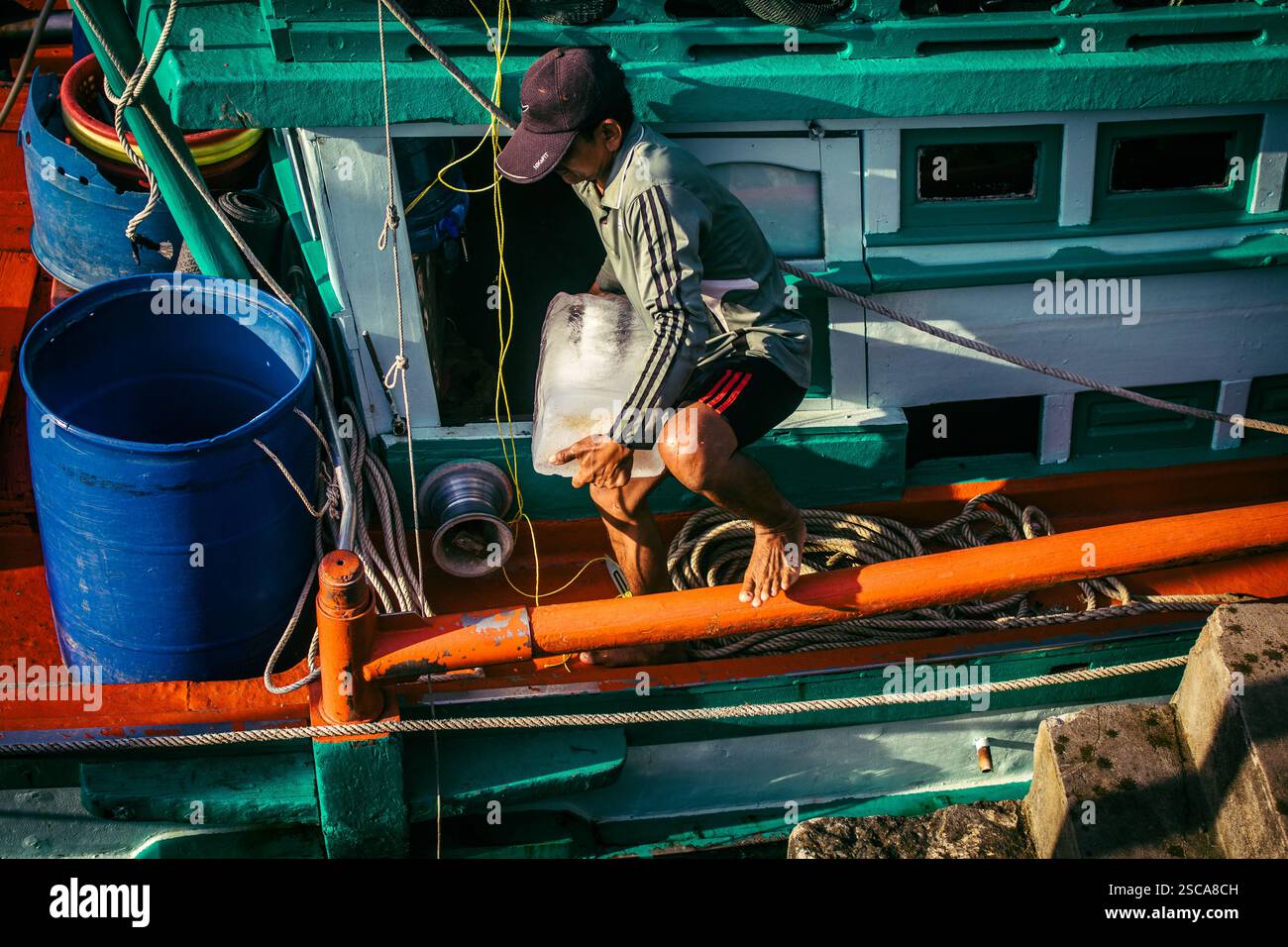 Preak Svay, Koh Rong Island, Cambodia, February 6, 2025 Fisherman in an ...