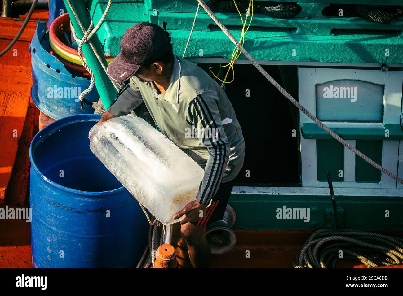 Preak Svay, Koh Rong Island, Cambodia, February 6, 2025 Fisherman in an ...