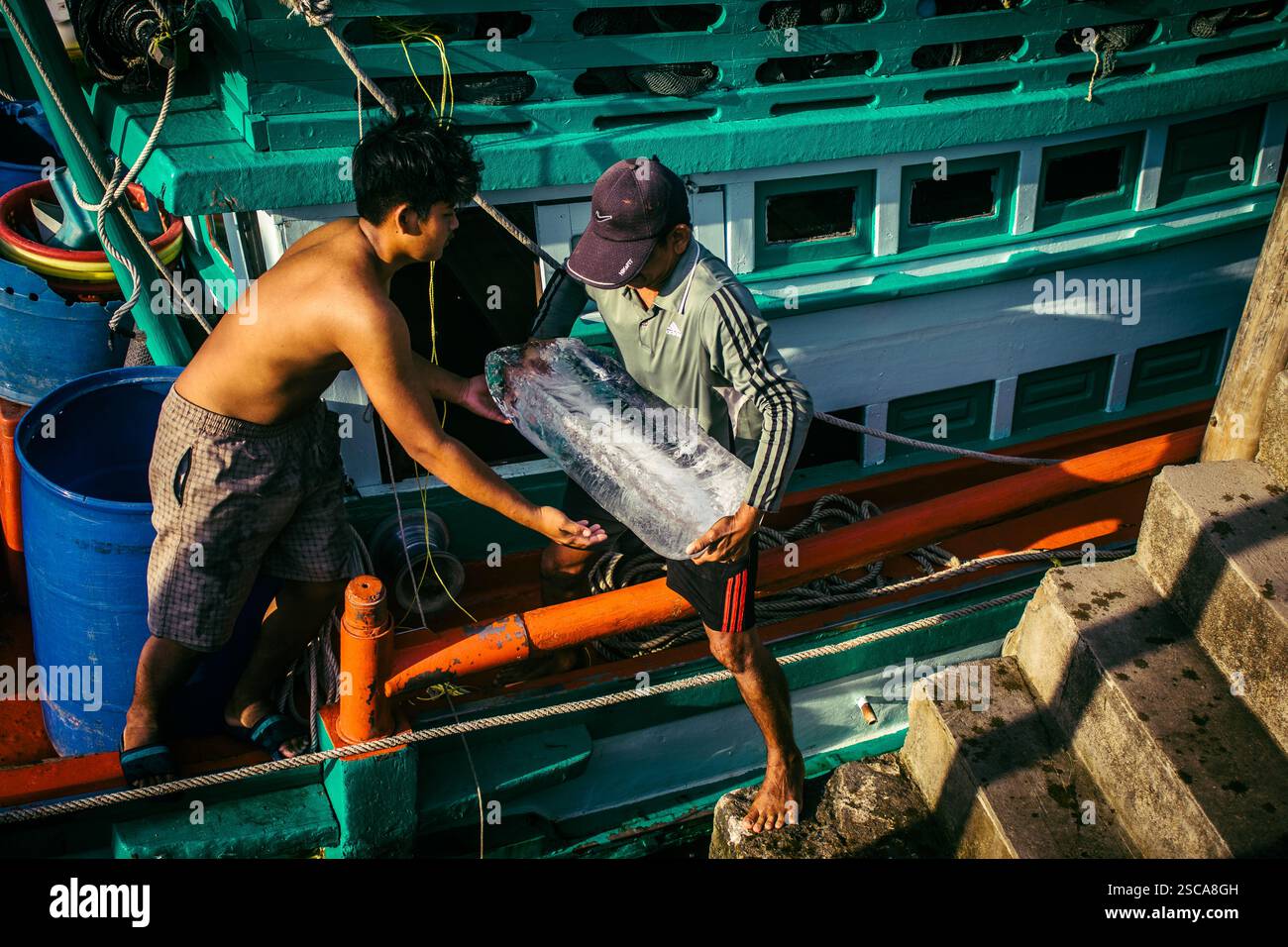 Preak Svay, Koh Rong Island, Cambodia, February 6, 2025 Fisherman in an ...